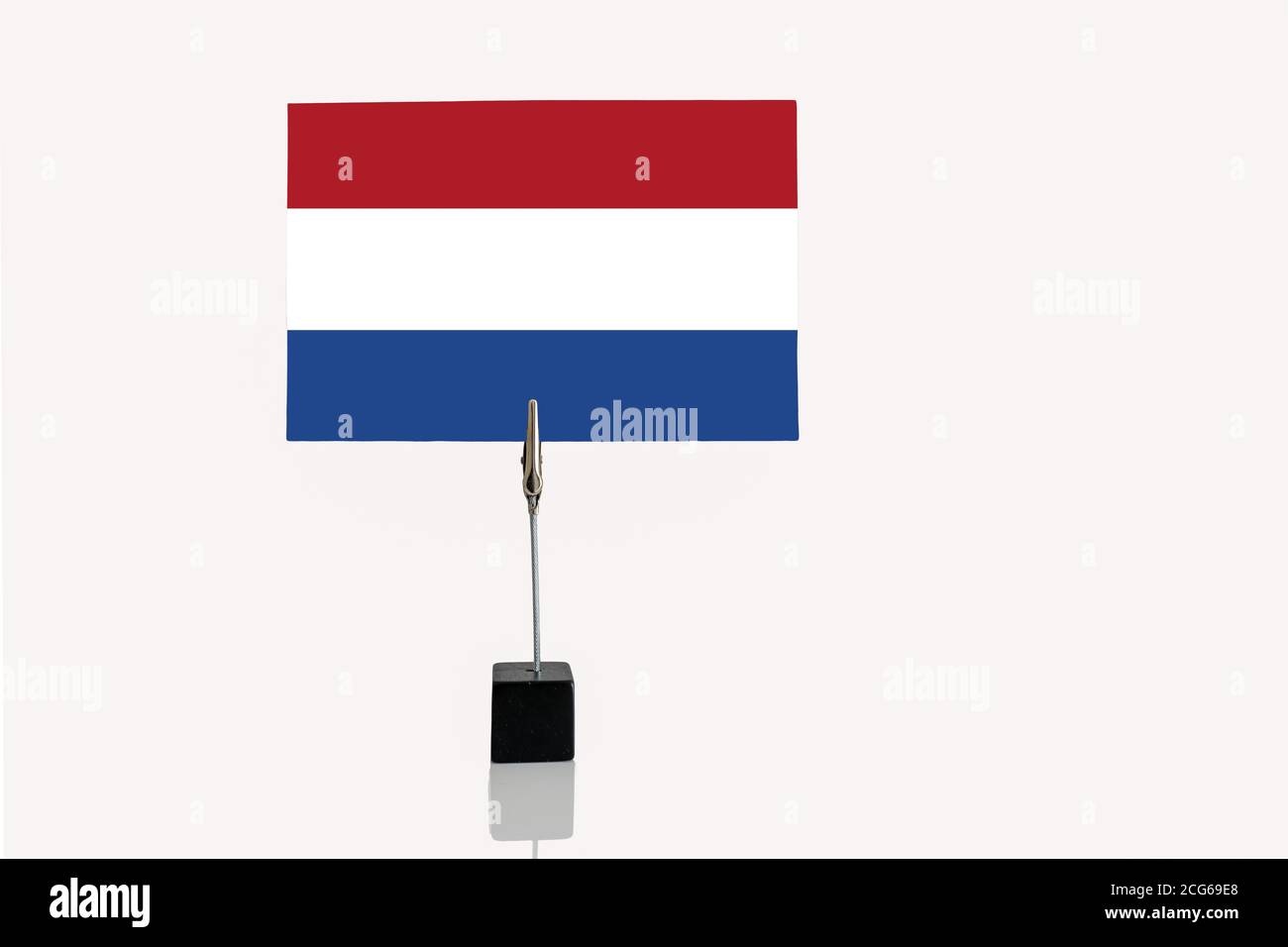 Dutch Republic minature flag in cube base in photograph holder on a ...