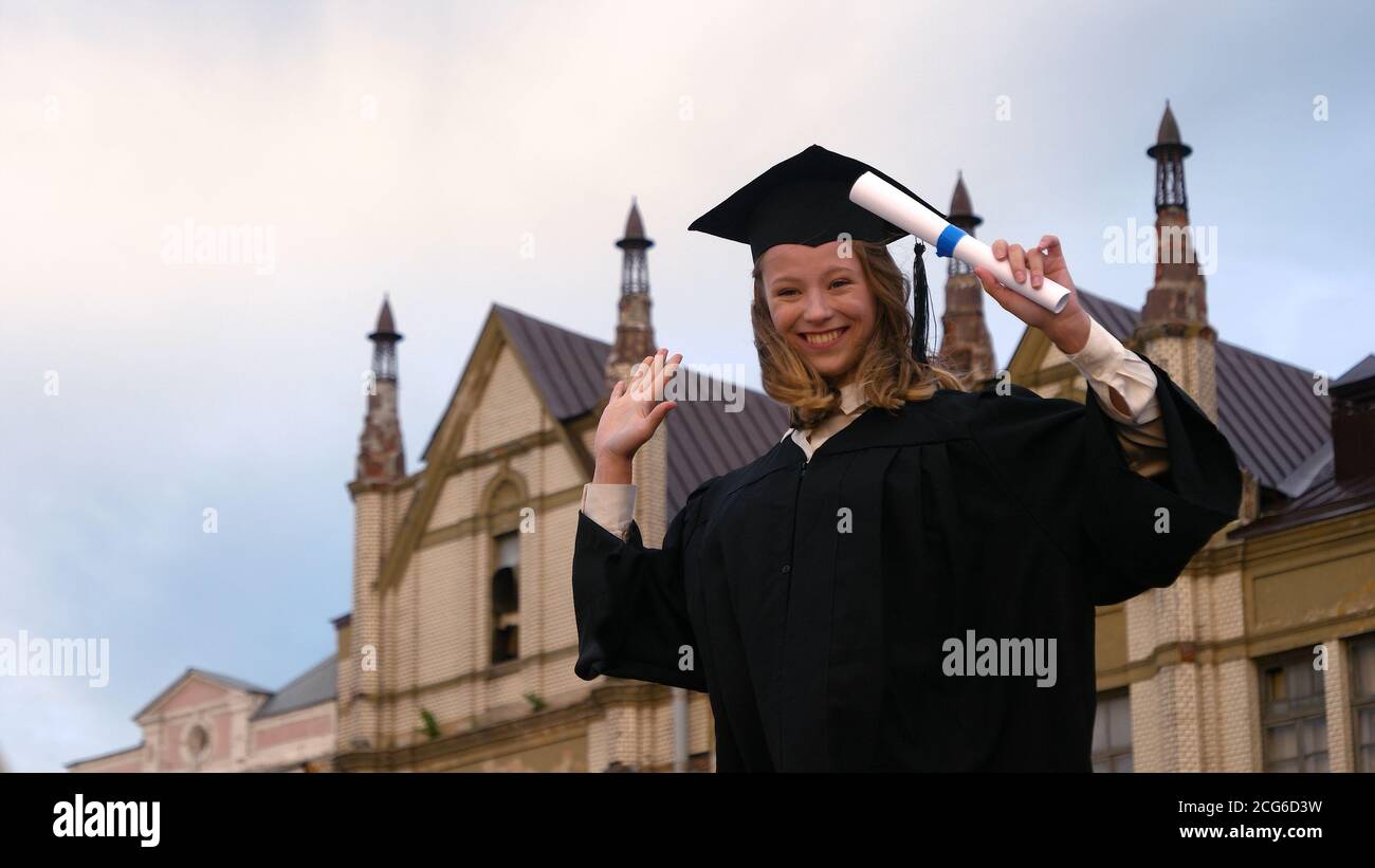 Graduation: Girl is being photographed in front of the college Stock ...
