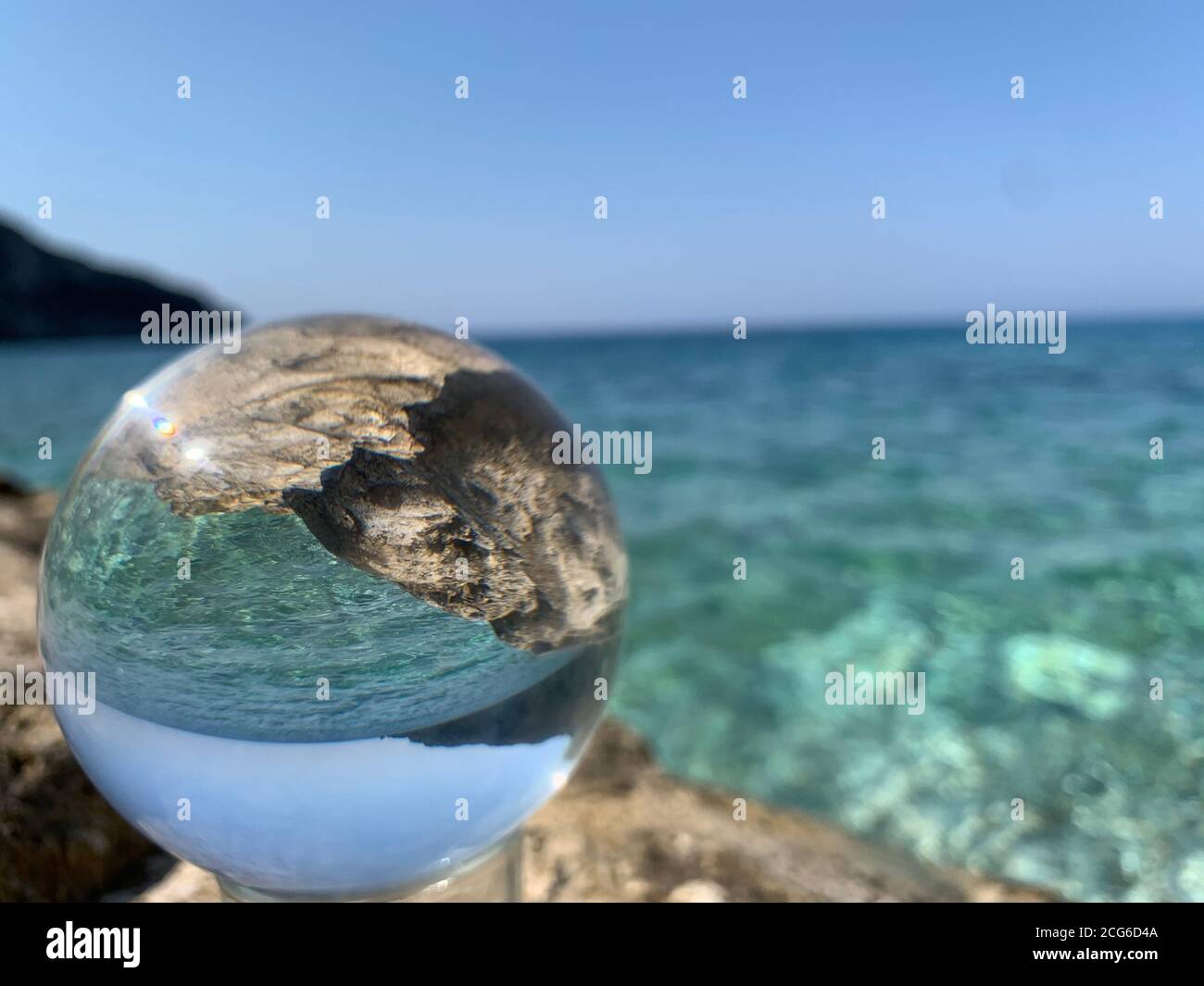 close up crystal glass ball at the beach Stock Photo - Alamy