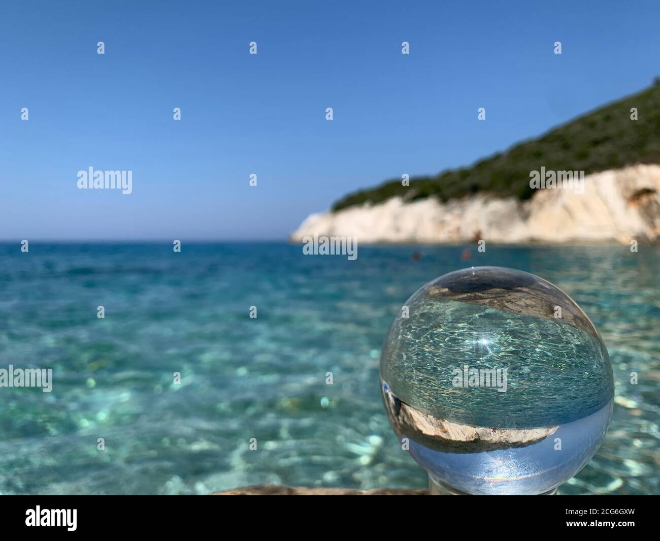 close up crystal glass ball at the beach Stock Photo - Alamy