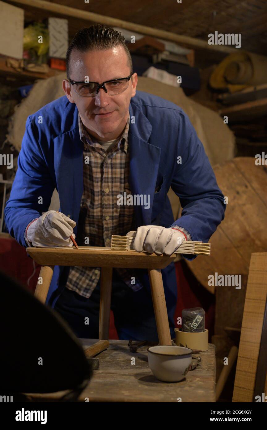 Carpenter working in his workshop Stock Photo - Alamy
