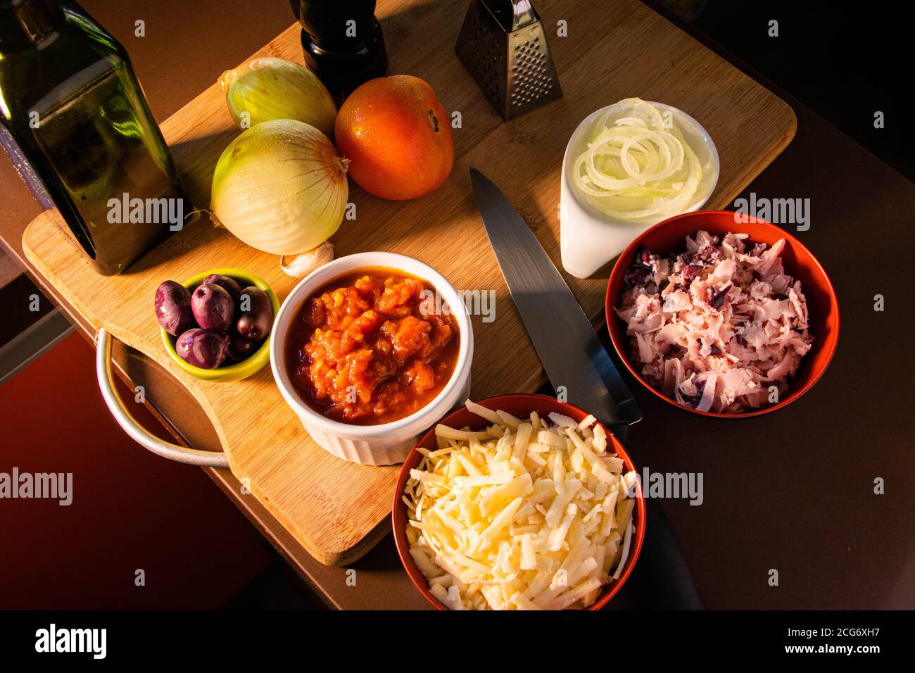 Bowls of pizza toppings in a kitchen Stock Photo - Alamy