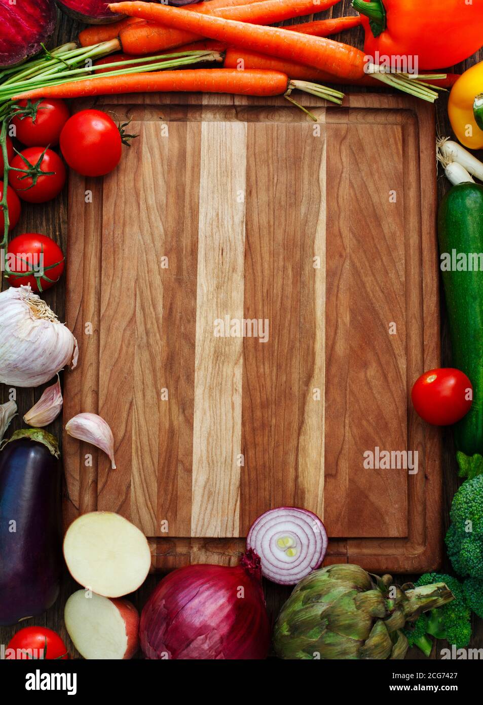 Wooden chopping board surrounded by Fresh fruit and vegetables Stock ...
