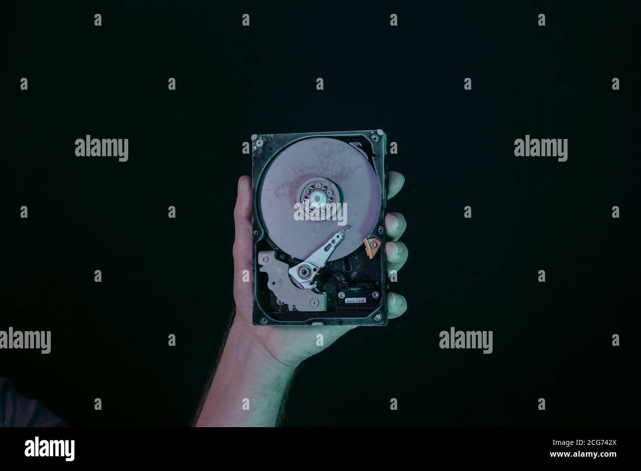 Hand holding open detail frozen hard disk. Concept protection ...