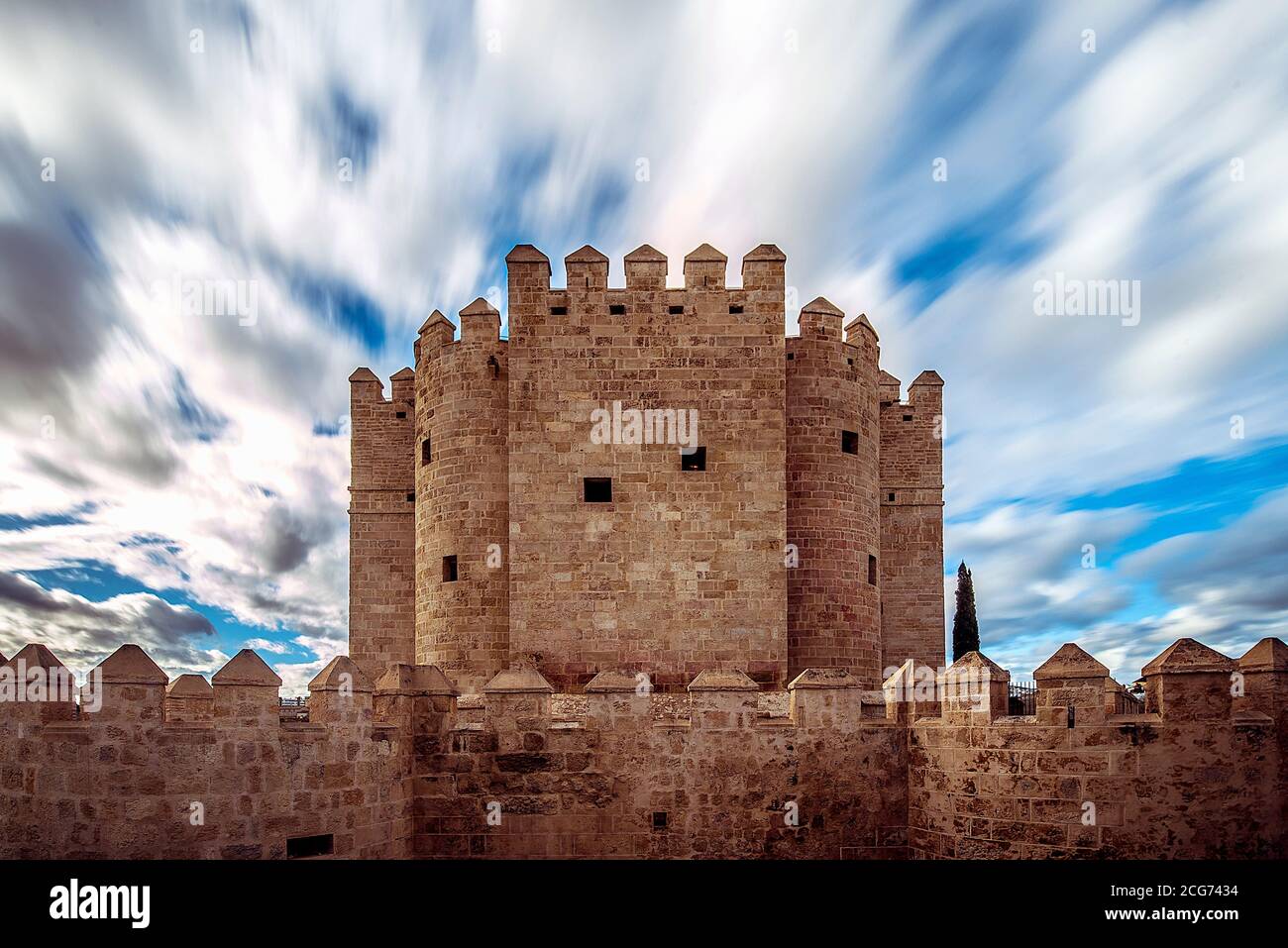 Calahorra Tower in Cordoba with a blue sky and white clouds Stock Photo ...