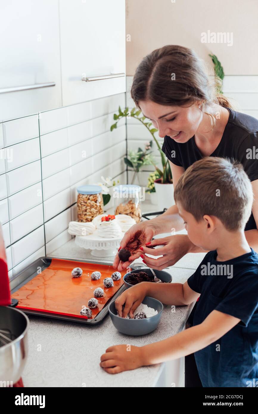 Mom pastry chef and son cook sweet cakes in the kitchen Stock Photo - Alamy