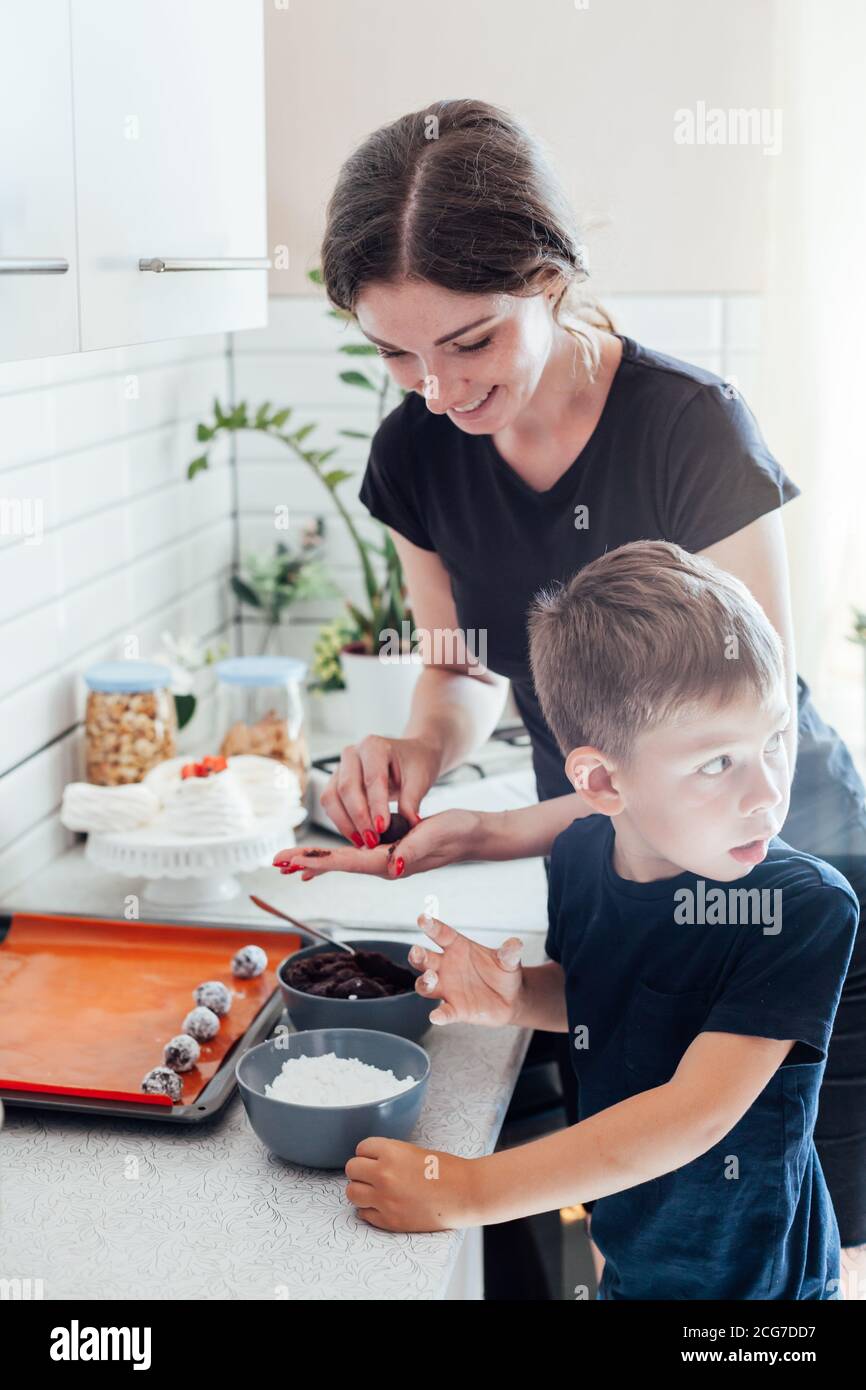 Mom pastry chef and son cook sweet cakes in the kitchen Stock Photo - Alamy