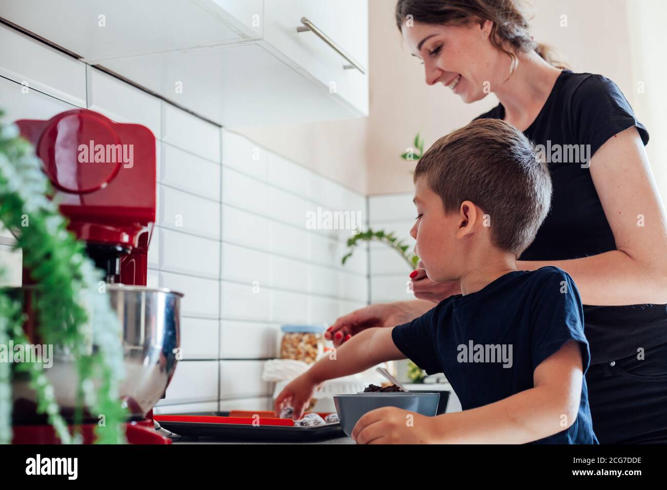 Mom pastry chef and son cook sweet cakes in the kitchen Stock Photo - Alamy