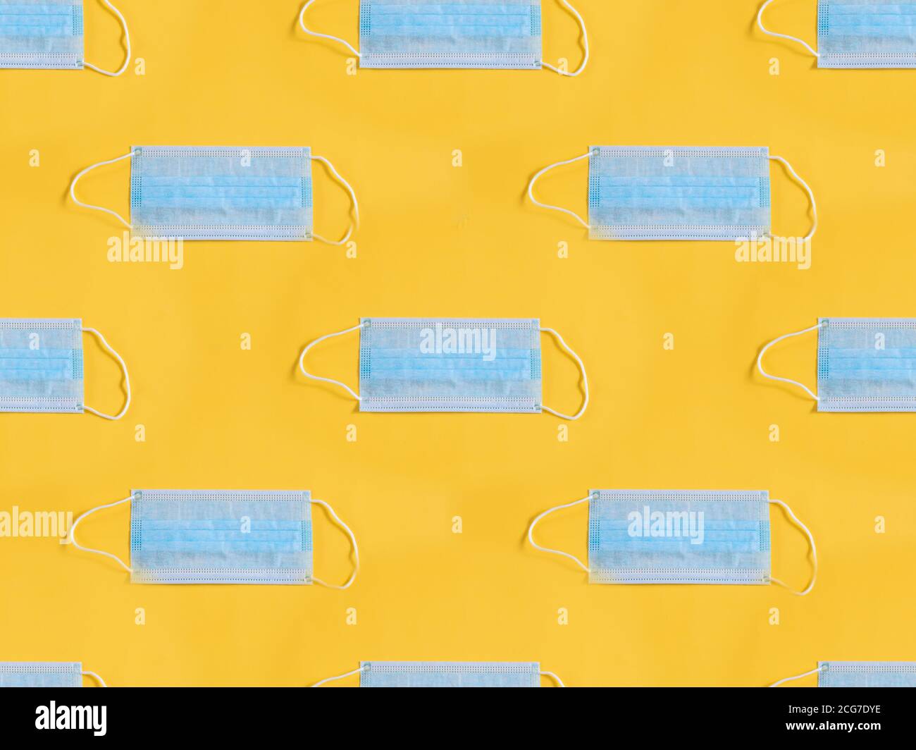 Surgical mask pattern on yellow background Stock Photo - Alamy