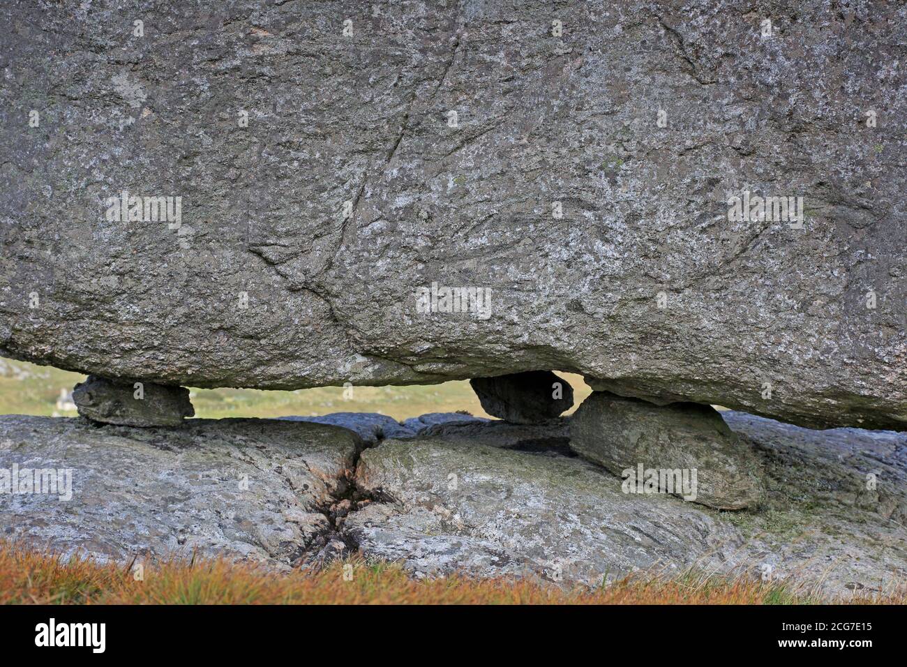 View of the small rocks holding up the Queen's Stone on the top of Ben ...