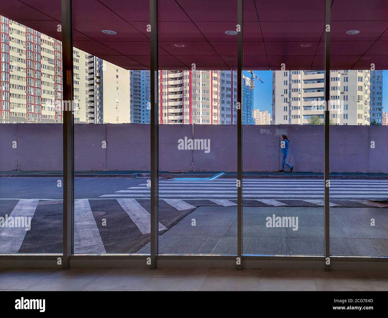 Man walking along wall hi-res stock photography and images - Alamy