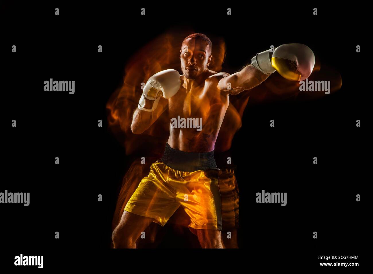 Fireball. Professional boxer training isolated on black studio ...