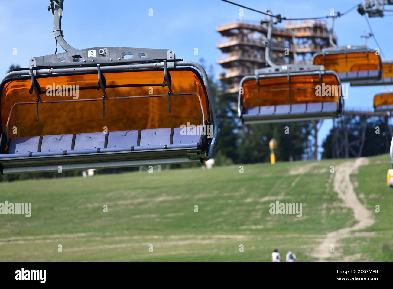 Orange cable car with seats and windshield Stock Photo - Alamy