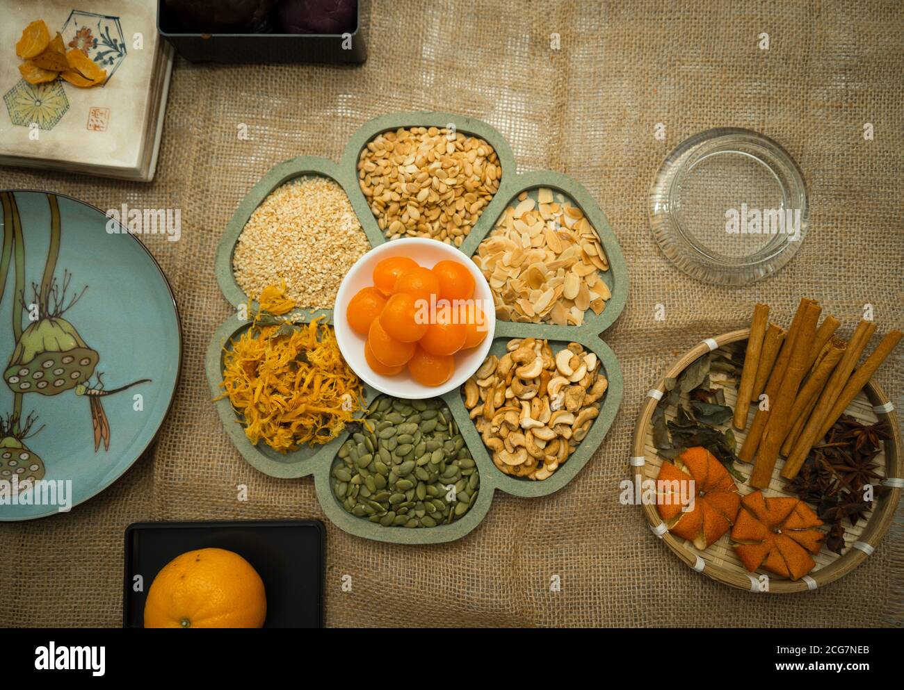 Flat lay mid autumn festival colorful food and drink on burlap ...