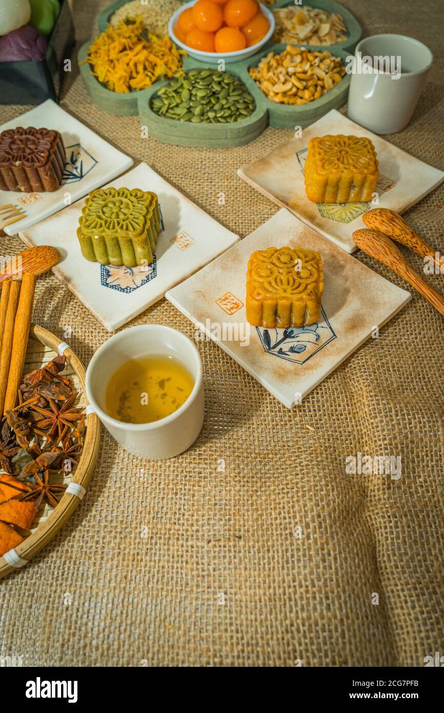 Mid-Autumn Festival moon cake, colorful food and drink on burlap ...
