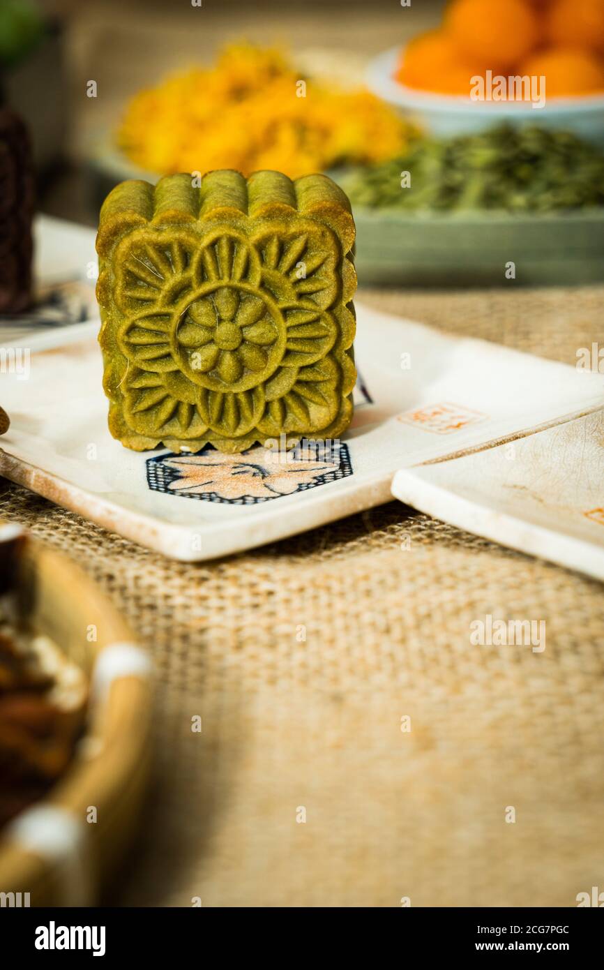 Mid-Autumn Festival moon cake, colorful food and drink on burlap ...