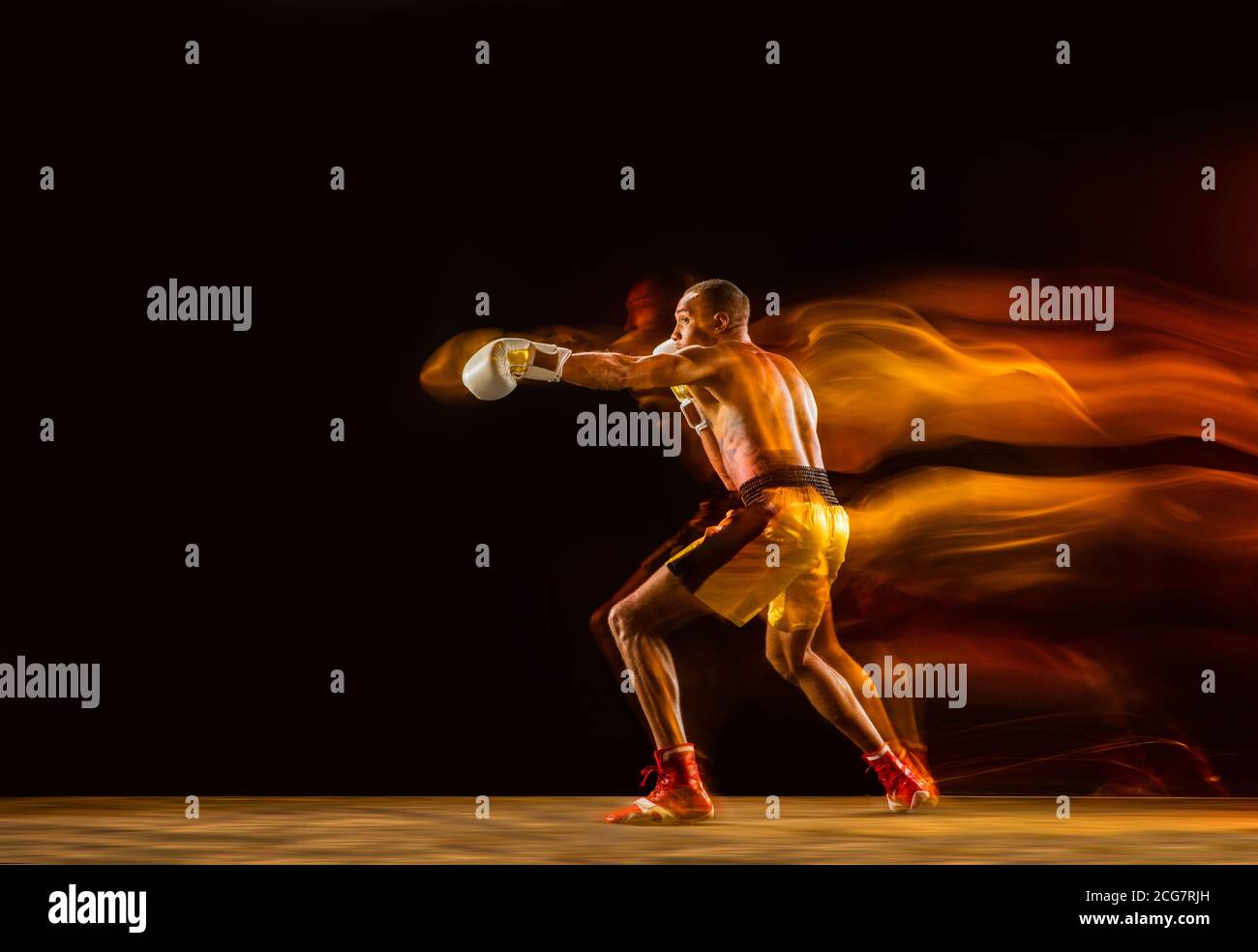 Speed. Professional boxer training isolated on black studio background ...
