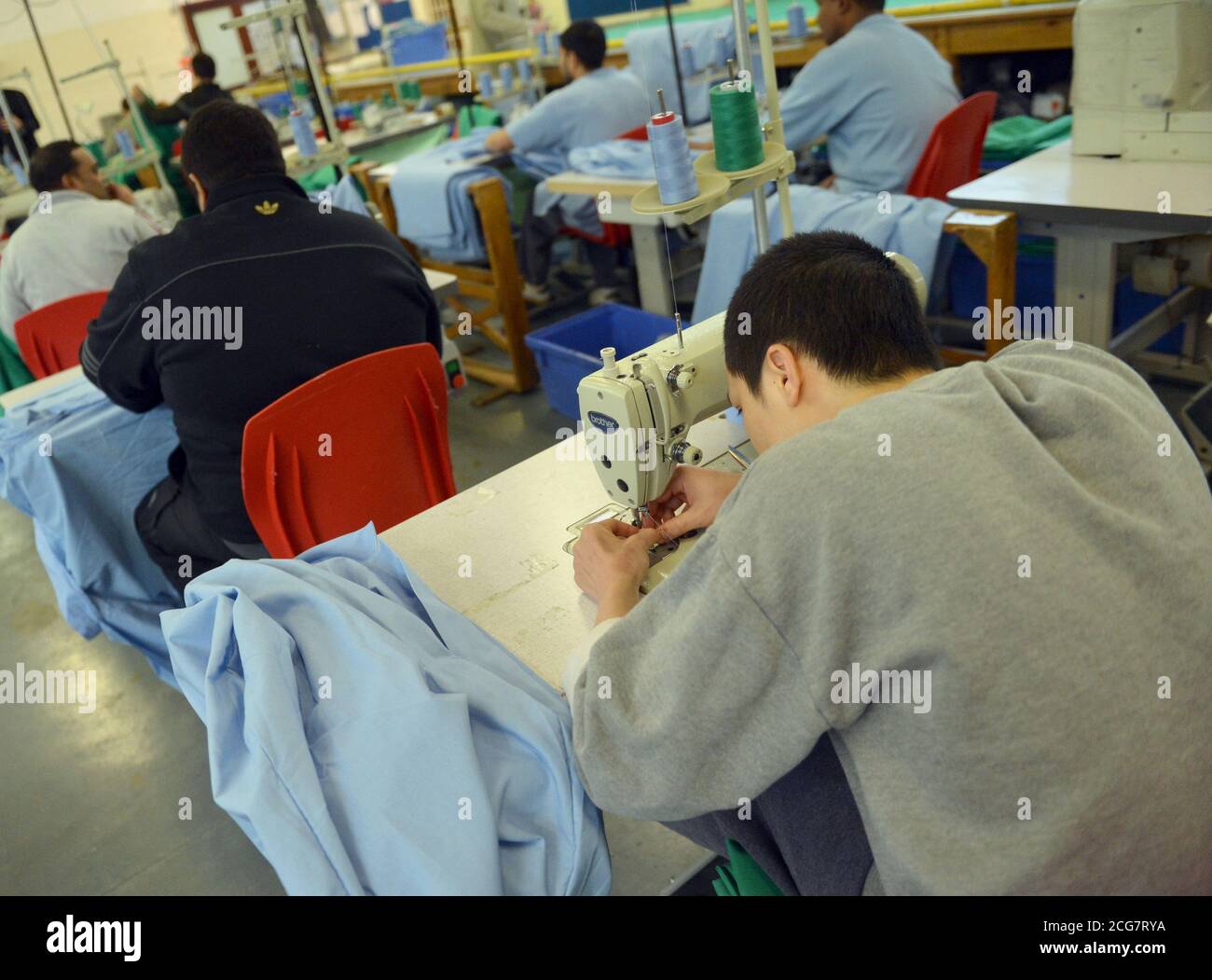 Inmates sew during a workshop at Pentonville Prison, London Stock Photo ...