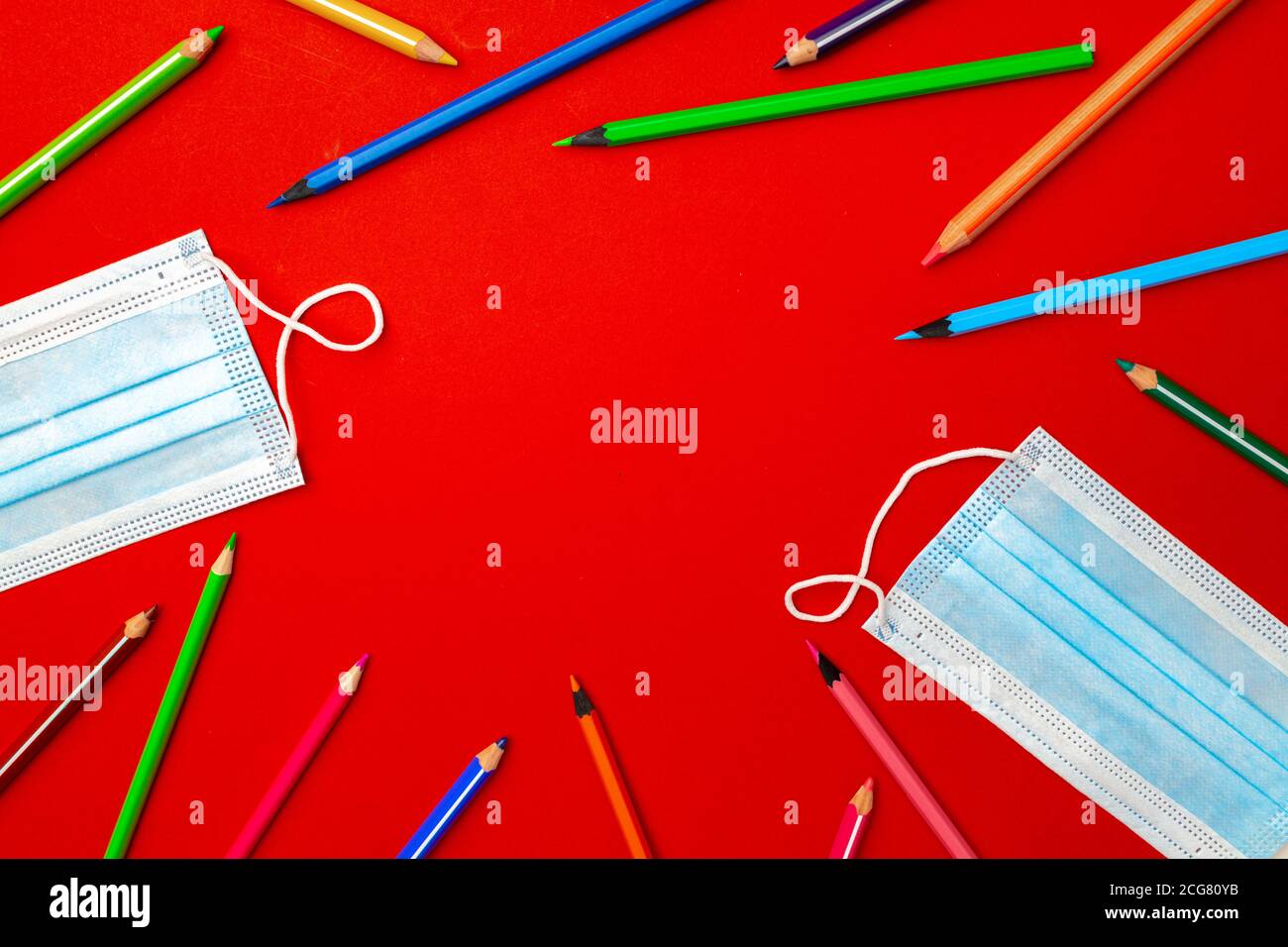 Colorful pencils and medical face mask. Pandemic education concept ...