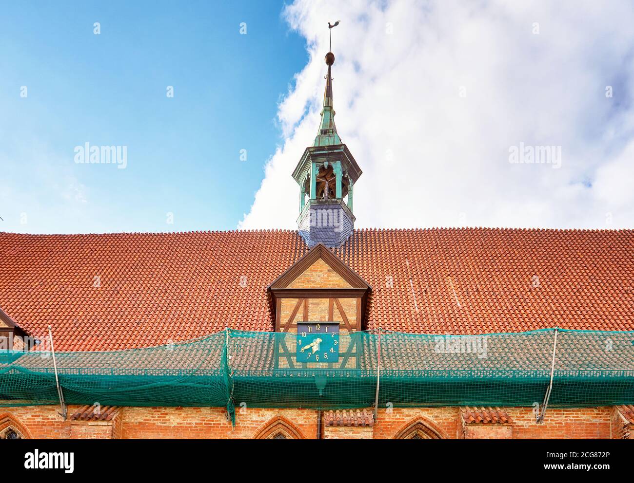 Protective net on an old red tile roof to catch falling roof tiles ...