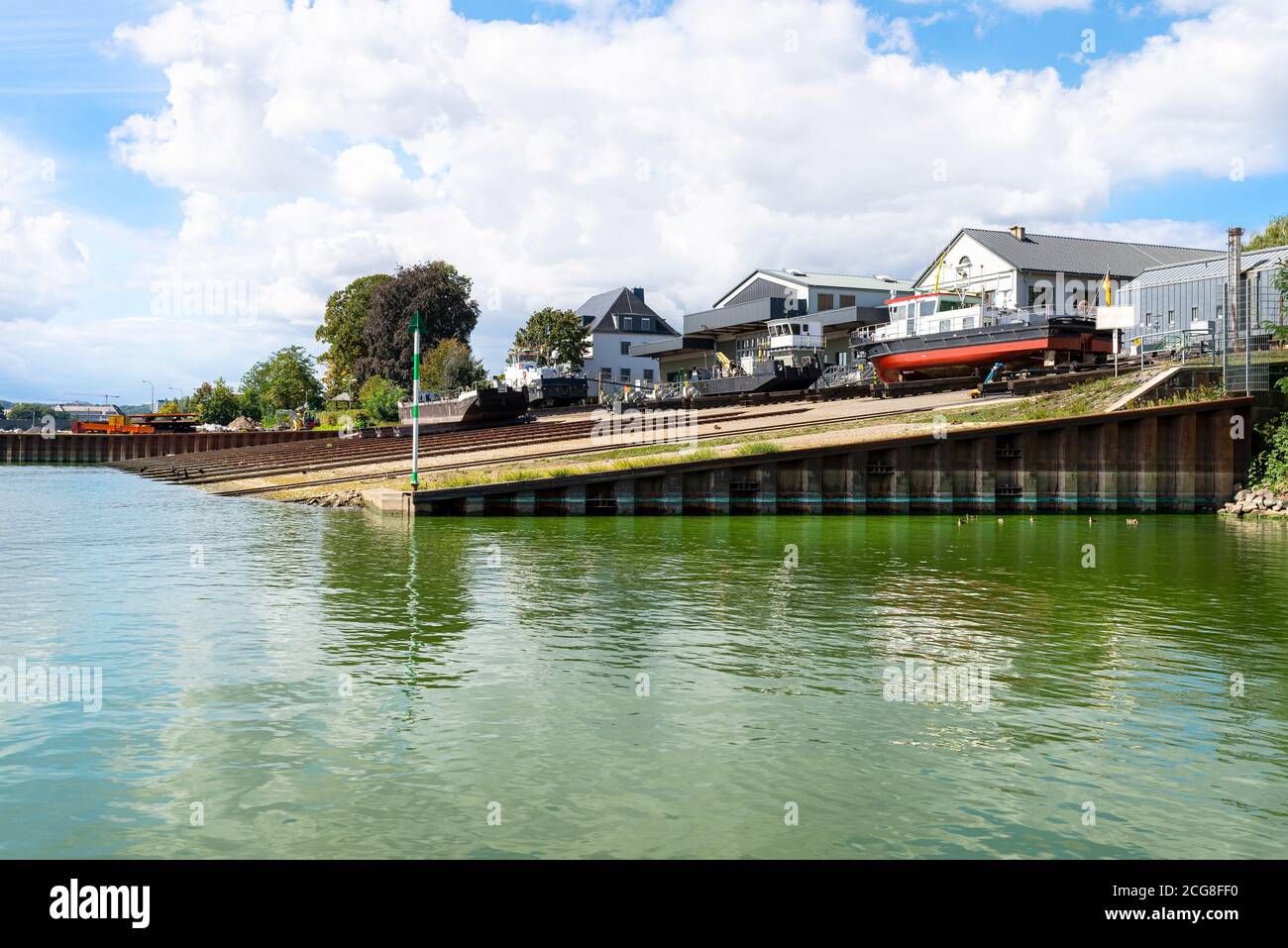 Dry dock with a slipway for launching ships in the channel by the river ...