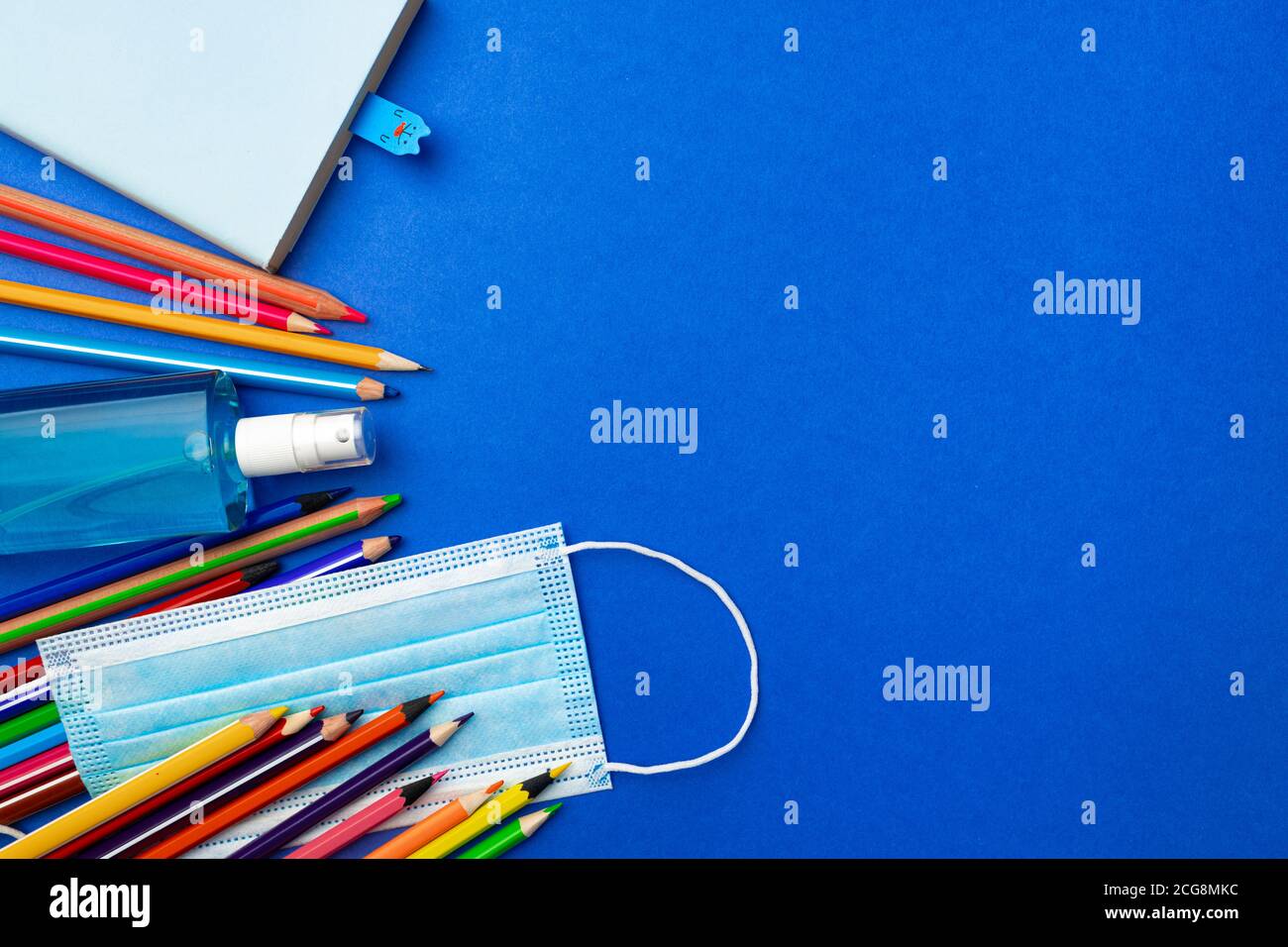 Colorful pencils and medical face mask. Pandemic education concept ...