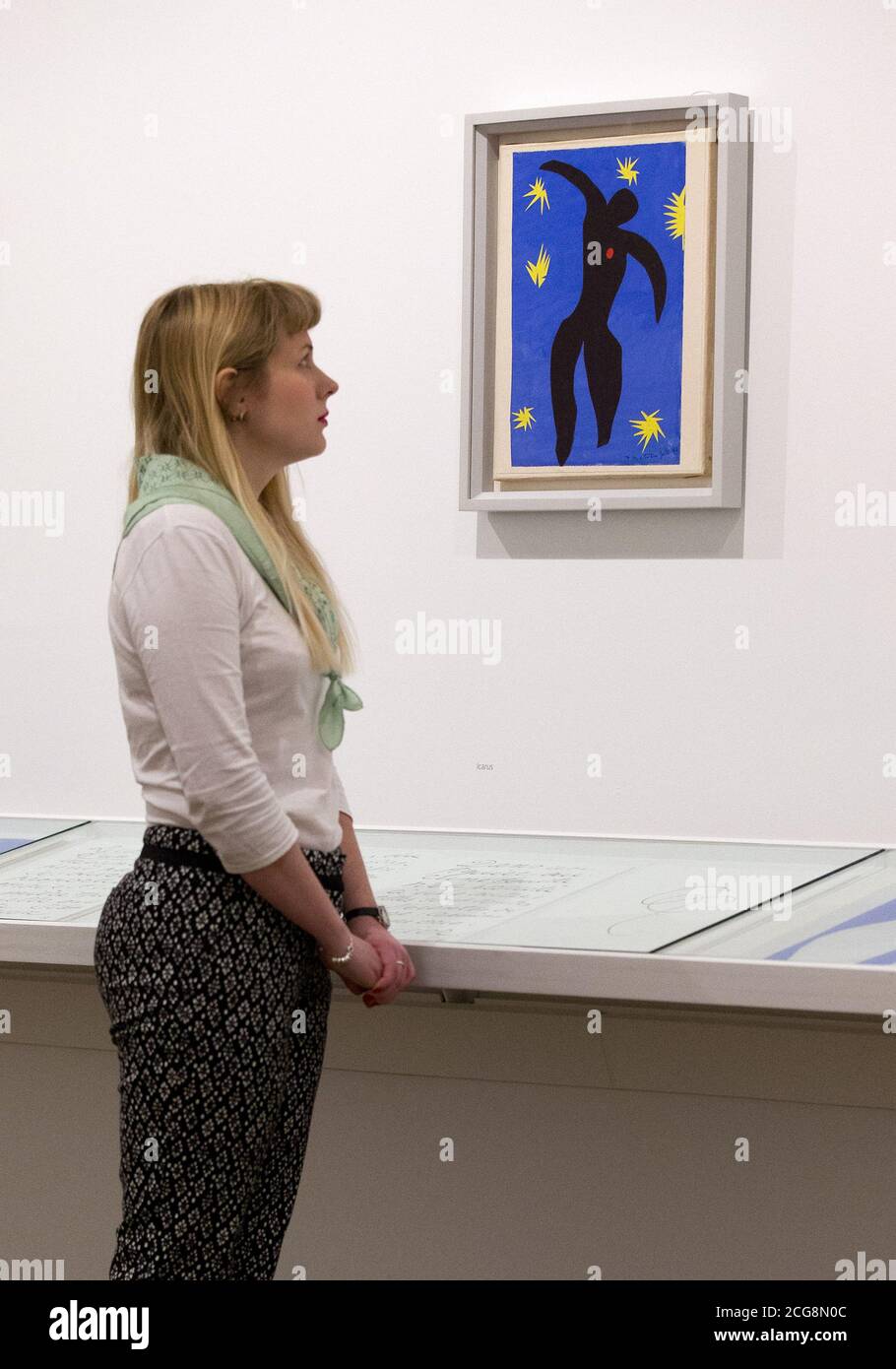 A gallery assistant poses in front of Icarus 1943 by Henri Matisse at ...