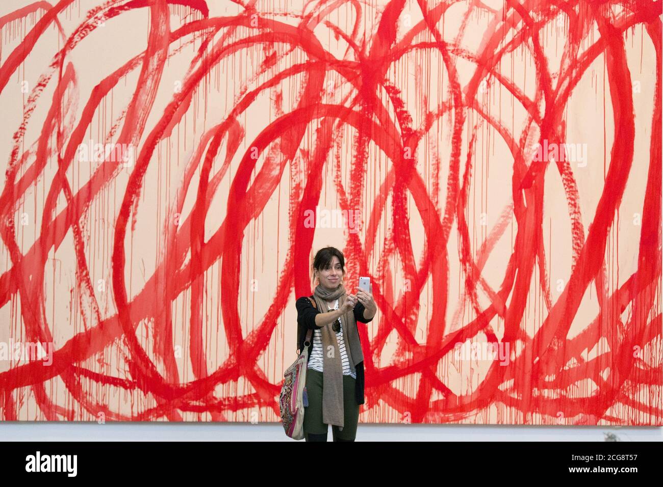A member of the public takes a selfie photograph in front of Untitled ...