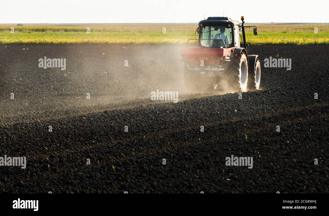 Tractor spreading artificial fertilizers. Transport, agricultural Stock ...