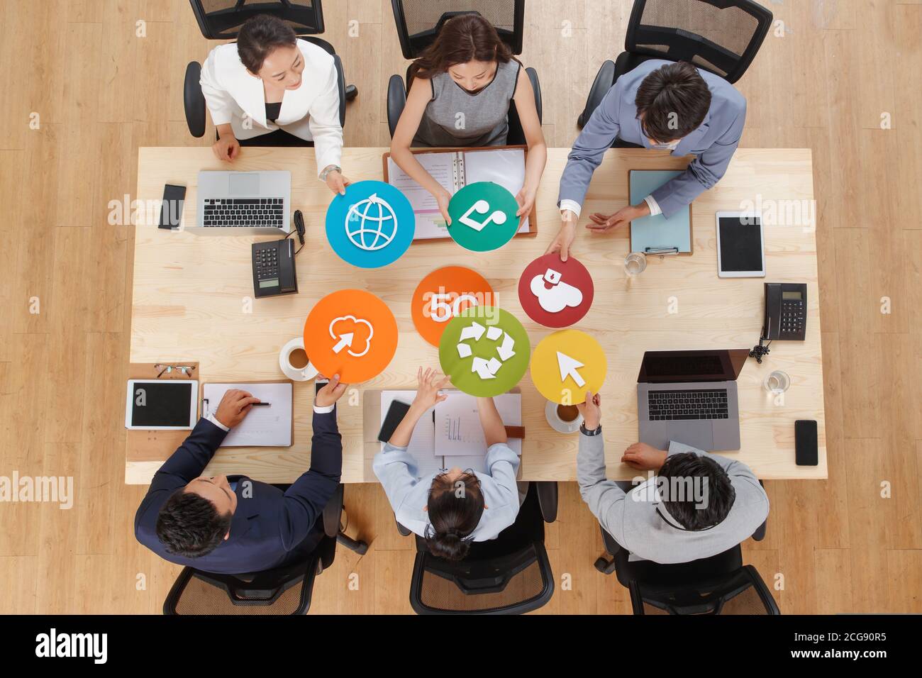 Business people working face to face with symbolic ICONS Stock Photo ...