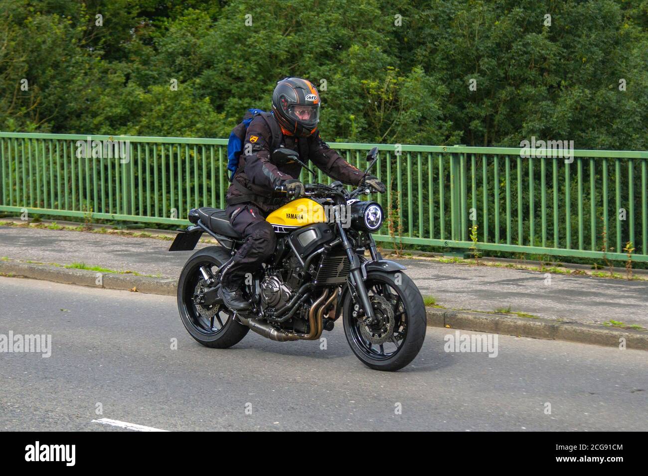 Yellow Yamaha Motorbike rider; two wheeled transport, motorcycles ...