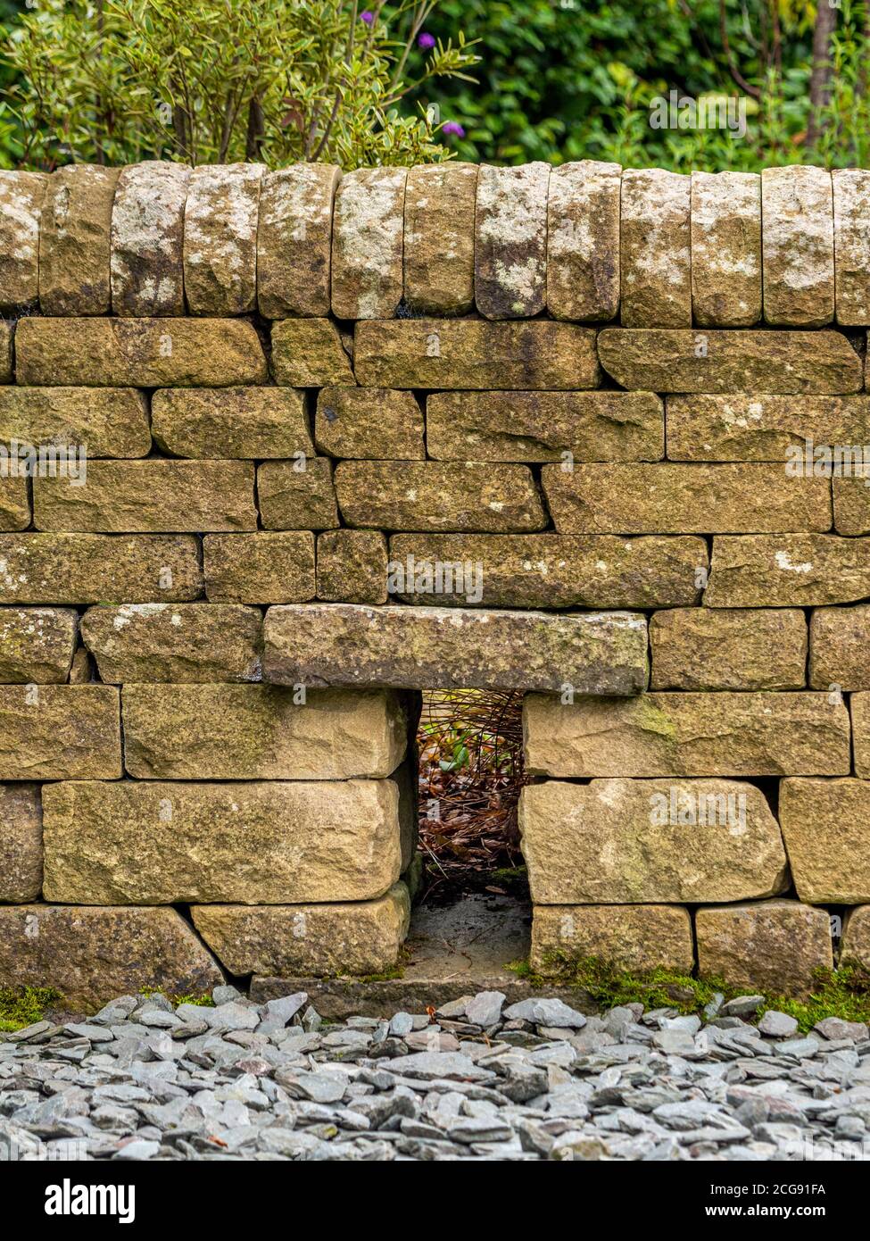 Small animal corridor or hedgehog highway in a newly built garden wall ...