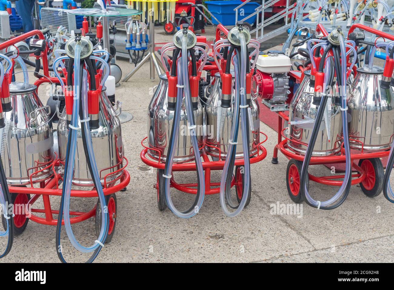 Portable Cow Milking Suction Machine at Dairy Farm Stock Photo - Alamy