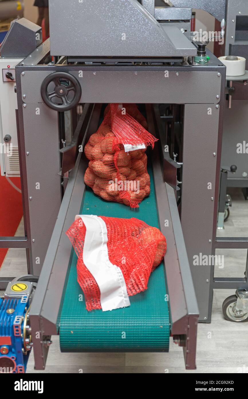 Potato Packing in Sack Bags Conveyor Belt Machine Stock Photo - Alamy