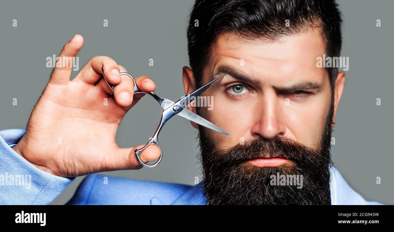 Male in barbershop, haircut, shaving. Bearded man isolated on gray ... Male in barbershop, haircut, shaving. Bearded man isolated on gray ...