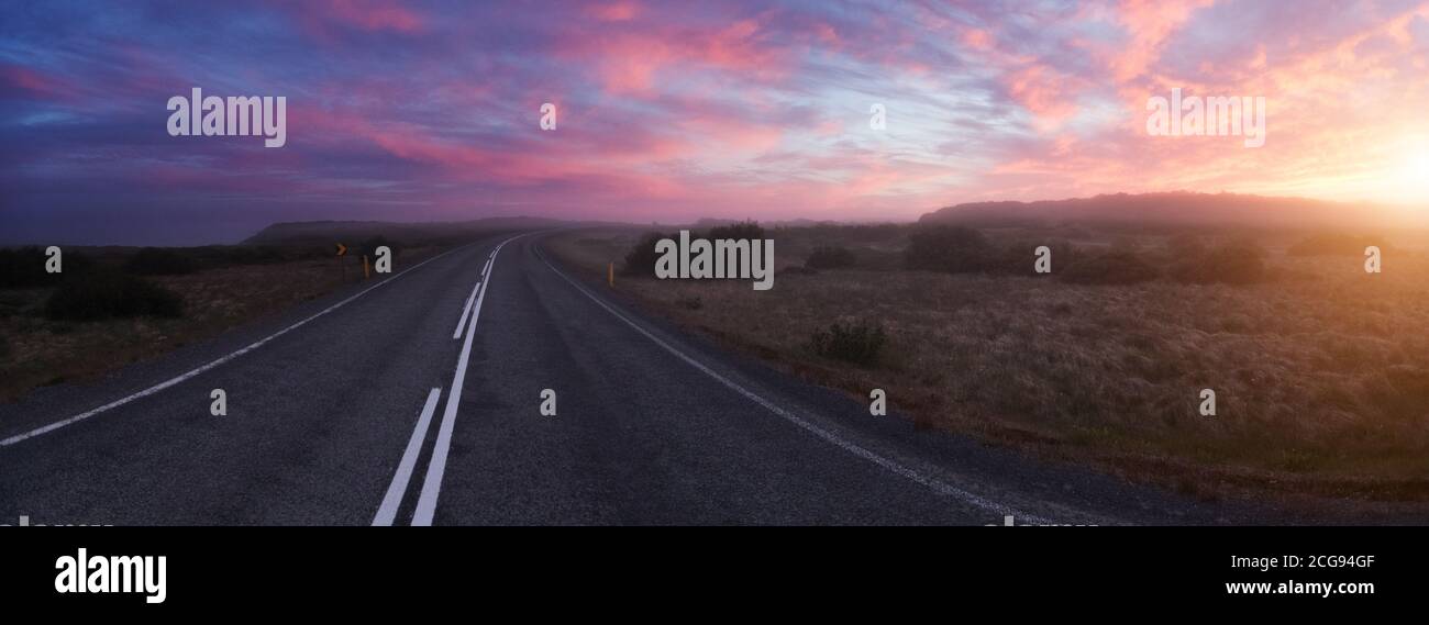 Empty asphalt road in Icelandic landscape. Transportation, travel and ...
