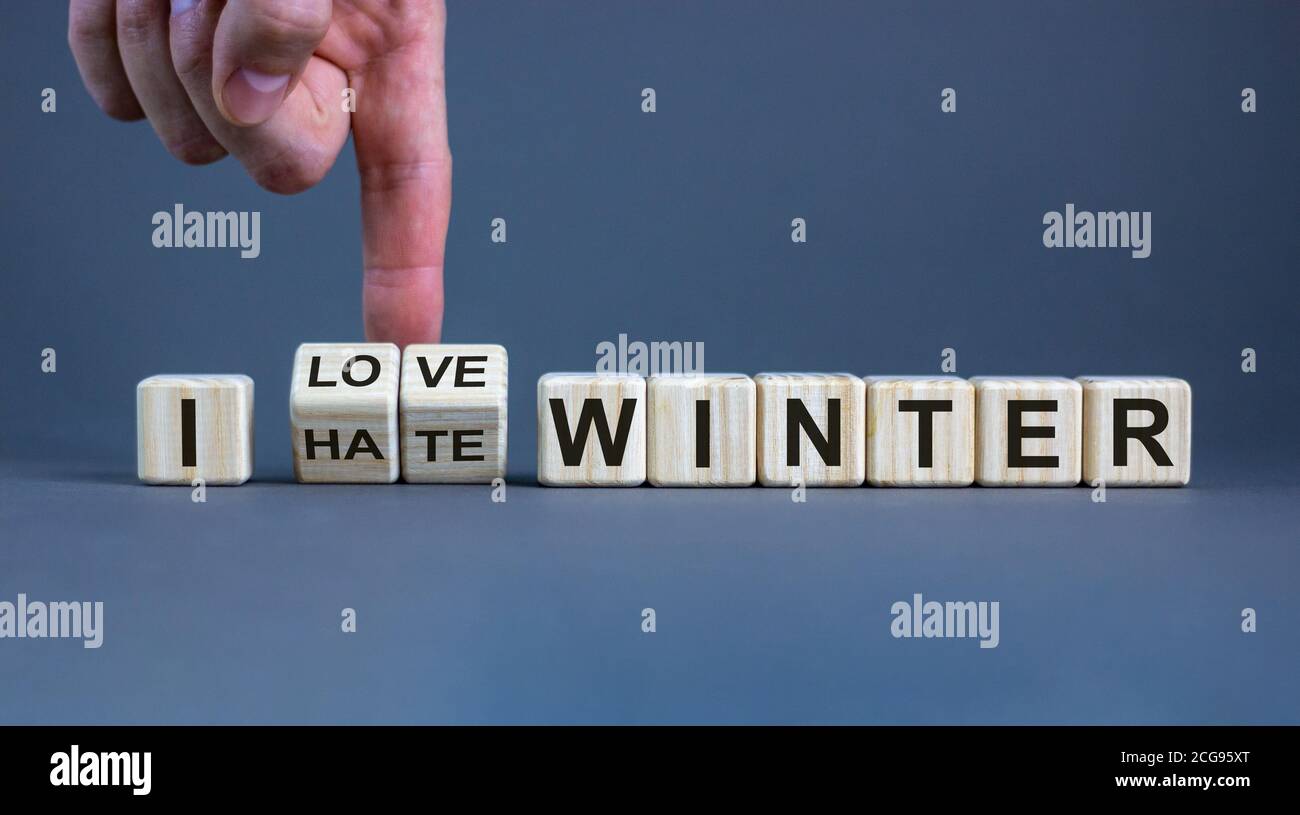 Hand turns cubes and changes the expression 'I hate winter' to 'I love ...