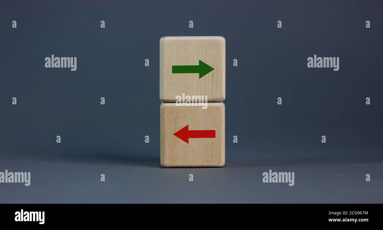Conceptual image of choice and direction. Wooden cubes with arrows ...