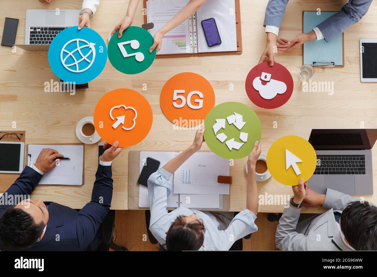 Business people working face to face with symbolic ICONS Stock Photo ...