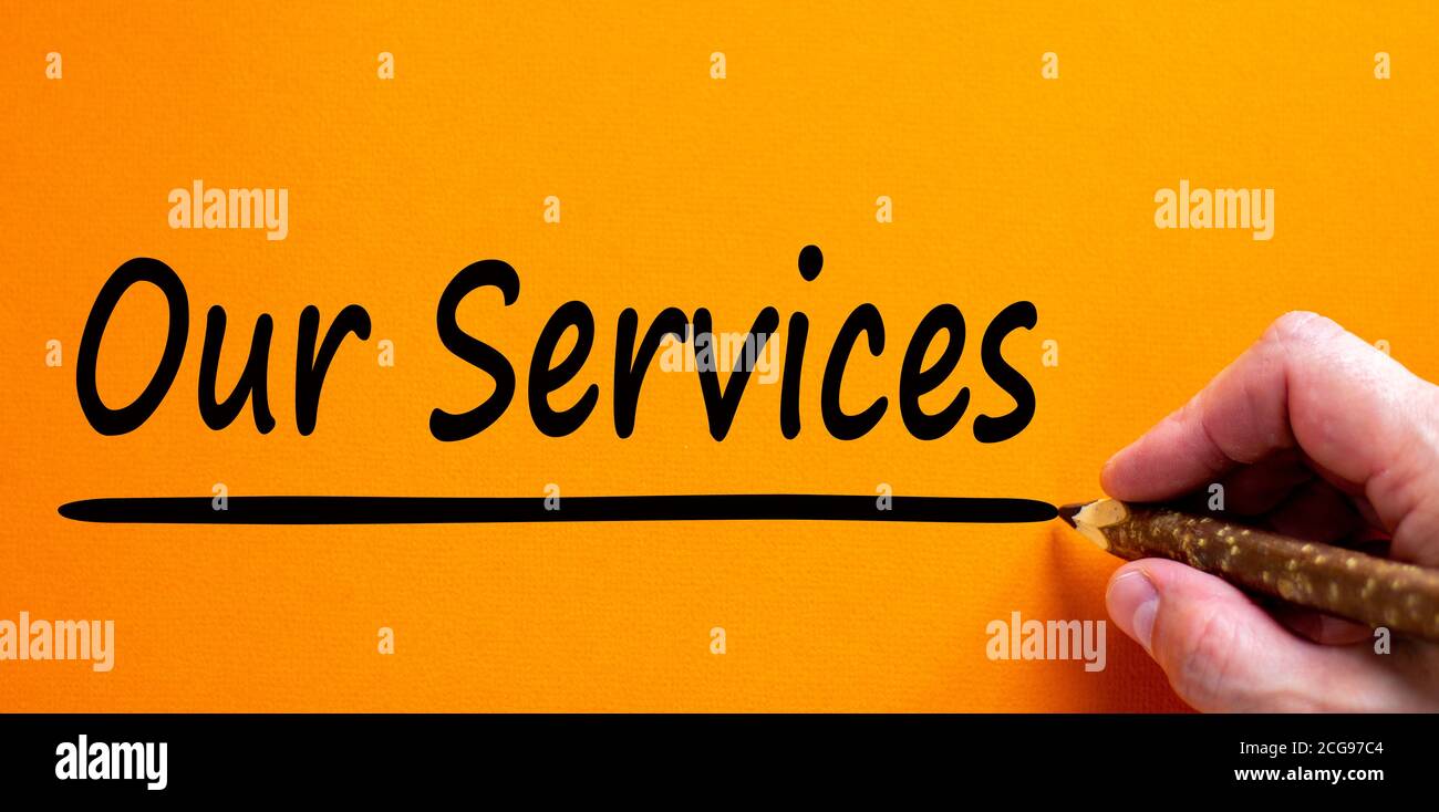 Hand writing 'our services', isolated on beautiful orange background ...