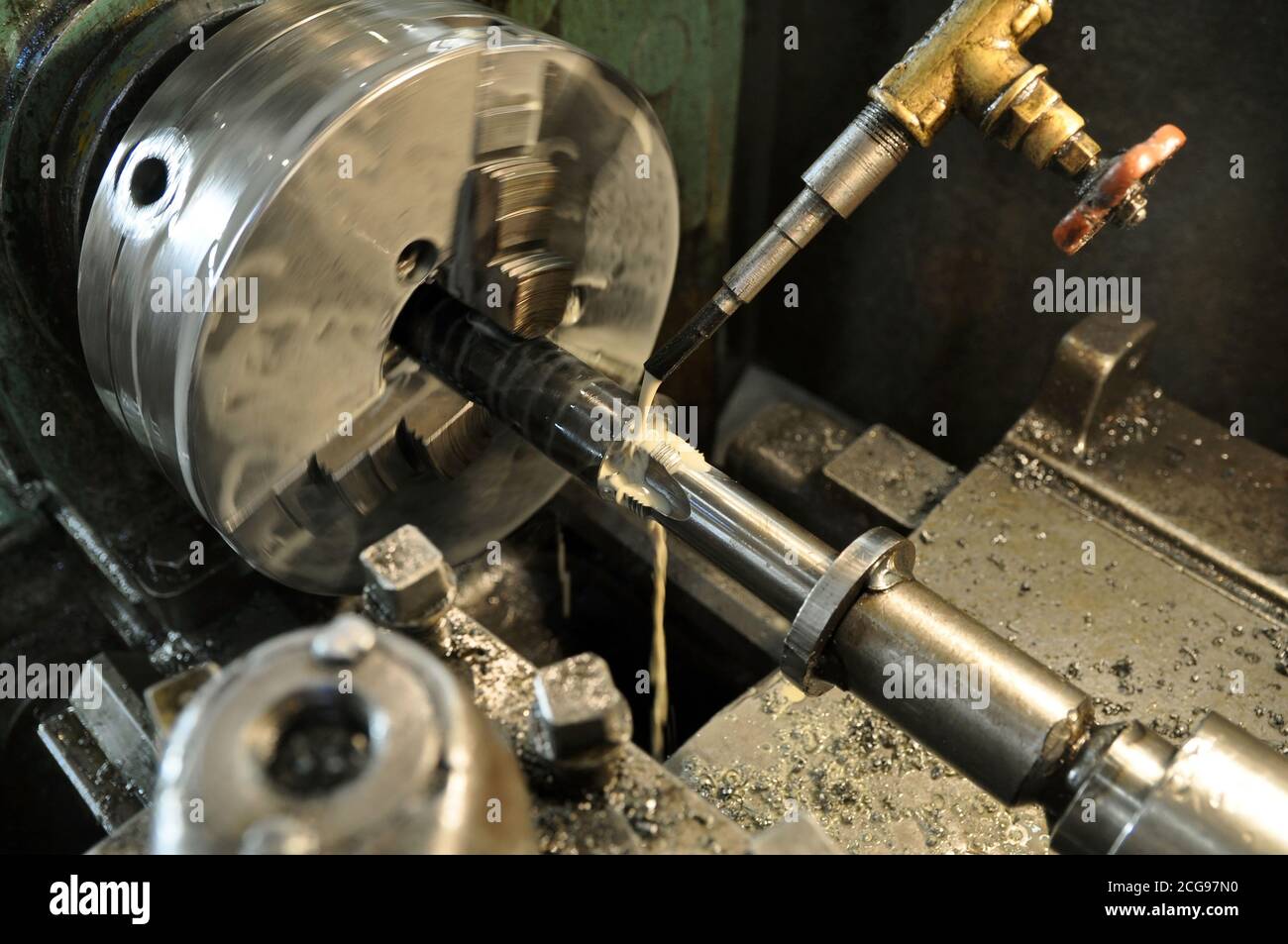 Metalworking machine at work. Lubricating and cooling fluid Stock Photo ...