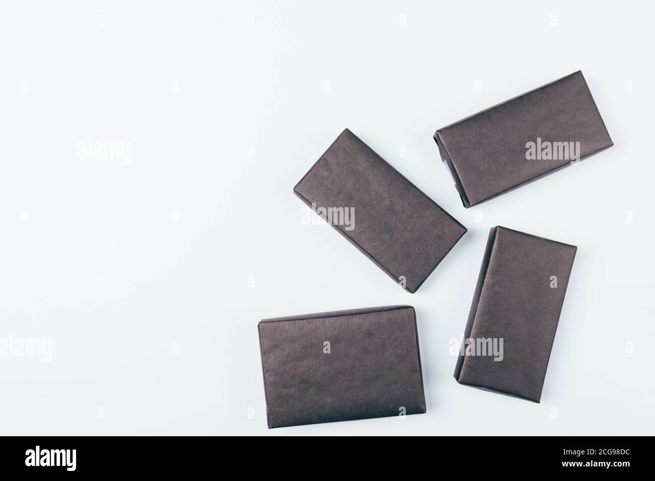 Flat lay composition roll of black paper for packing presents Stock ...