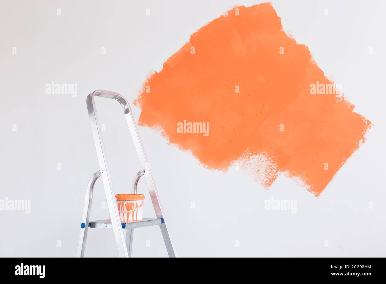 Ladder with paint in bucket near color wall indoors. Renovation and ...