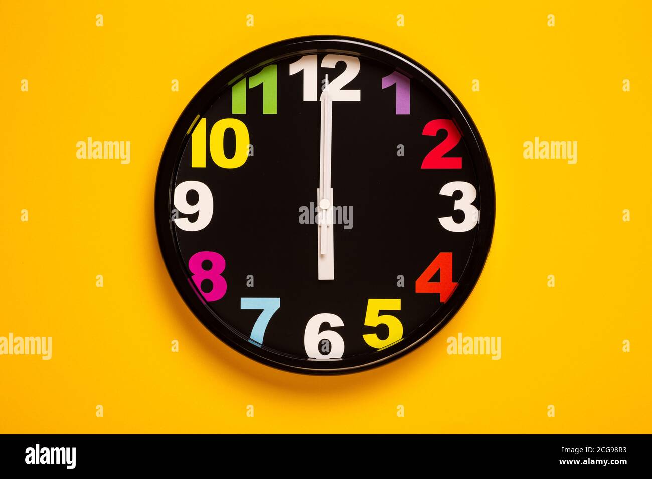 colorful wall clock show six o'clock Stock Photo - Alamy