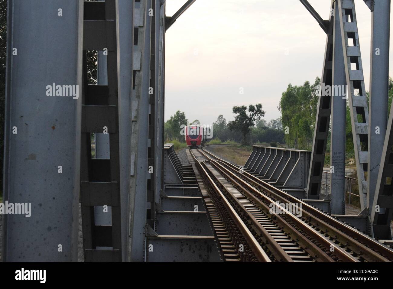 Iron made huge railway bridge with railway tracks Stock Photo - Alamy