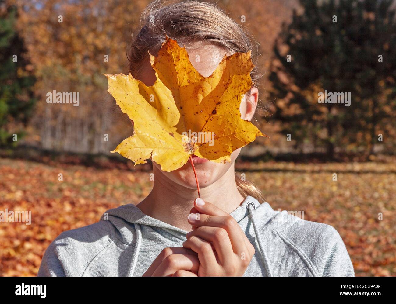 Woman leaf covering face hi-res stock photography and images - Alamy