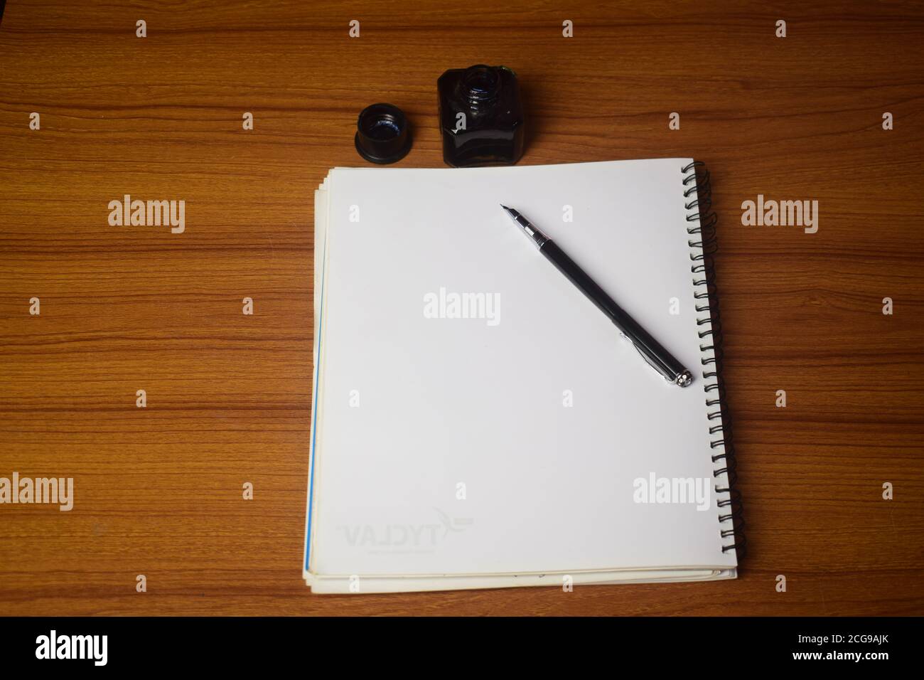 Fountain pen ink and notebook Stock Photo - Alamy