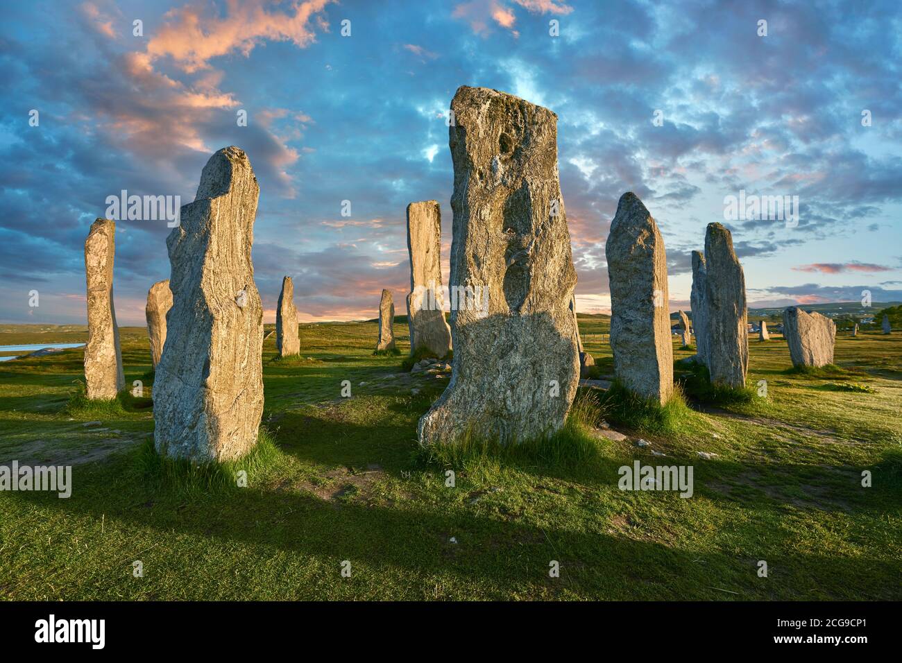 Calanais Standing Stones central stone, at sunset, circle erected ...