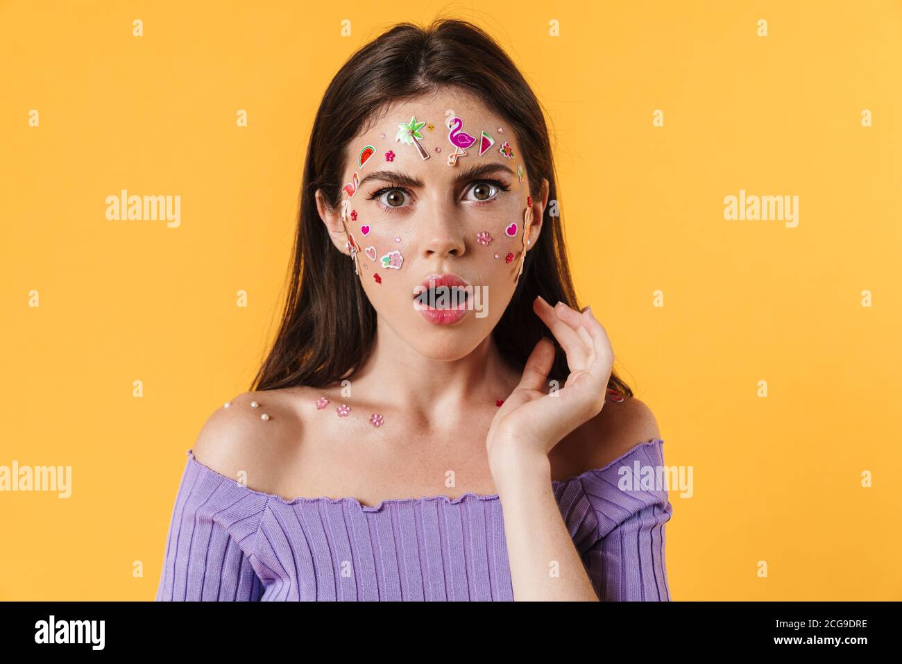Image of shocked woman with stickers on face expressing surprise at ...