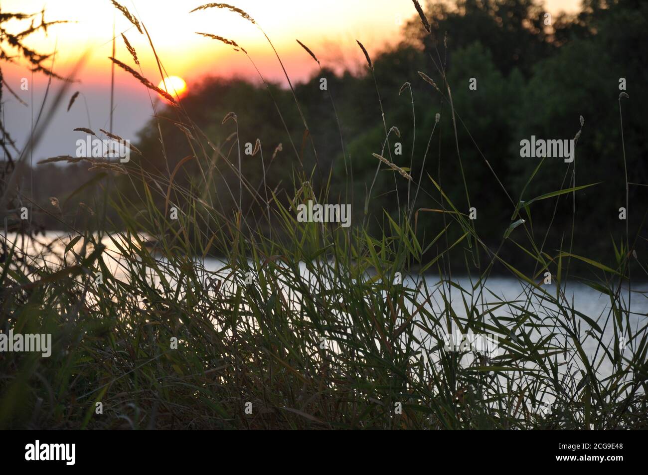Sunset Through Haze Stock Photo - Alamy